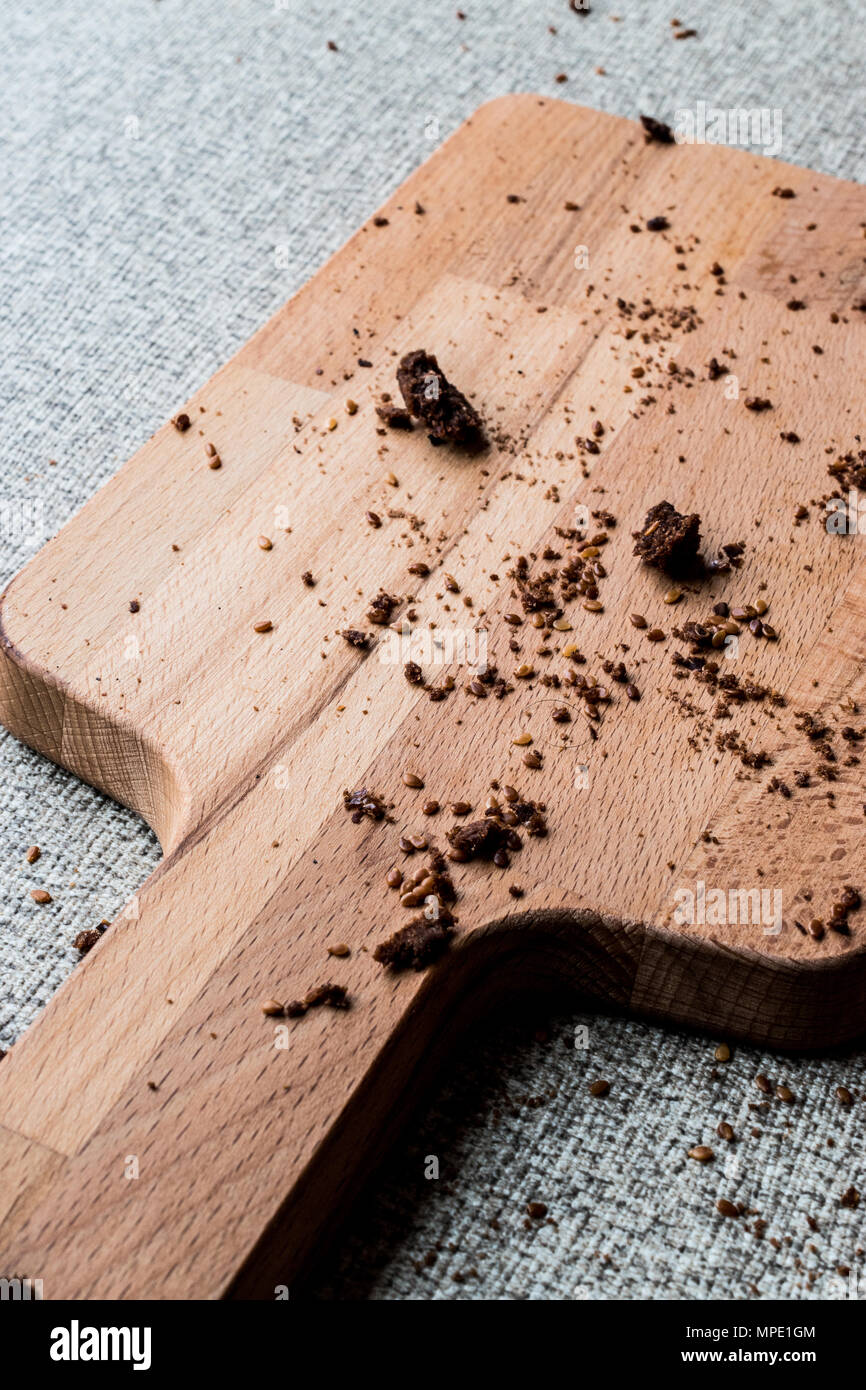 Cake crumbs on cutting board. eaten food concept Stock Photo - Alamy