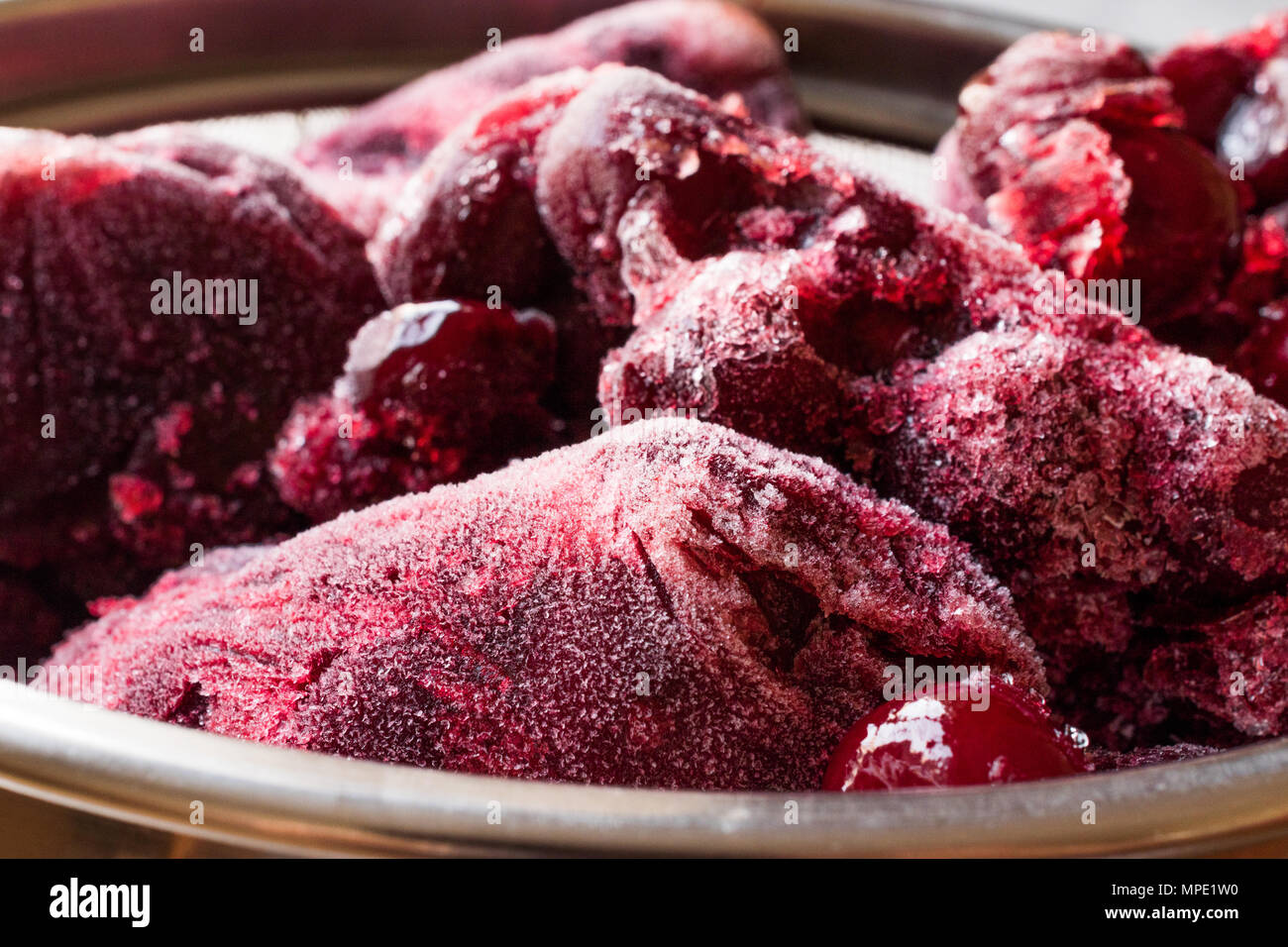 Whole Frozen Cherries in Metal Colander. Organic Food Stock Photo - Alamy