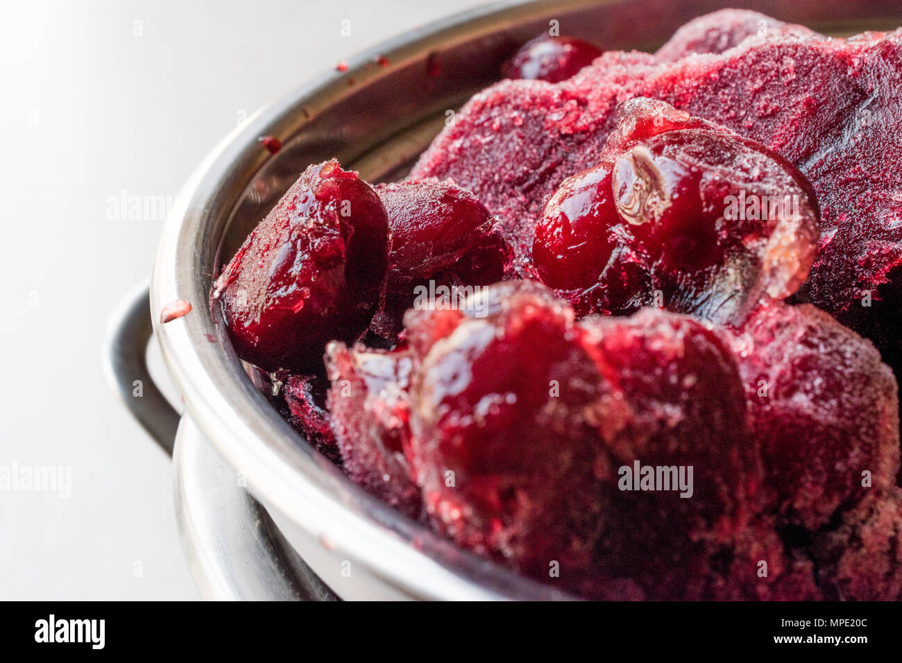 Whole Frozen Cherries in Metal Colander. Organic Food Stock Photo - Alamy
