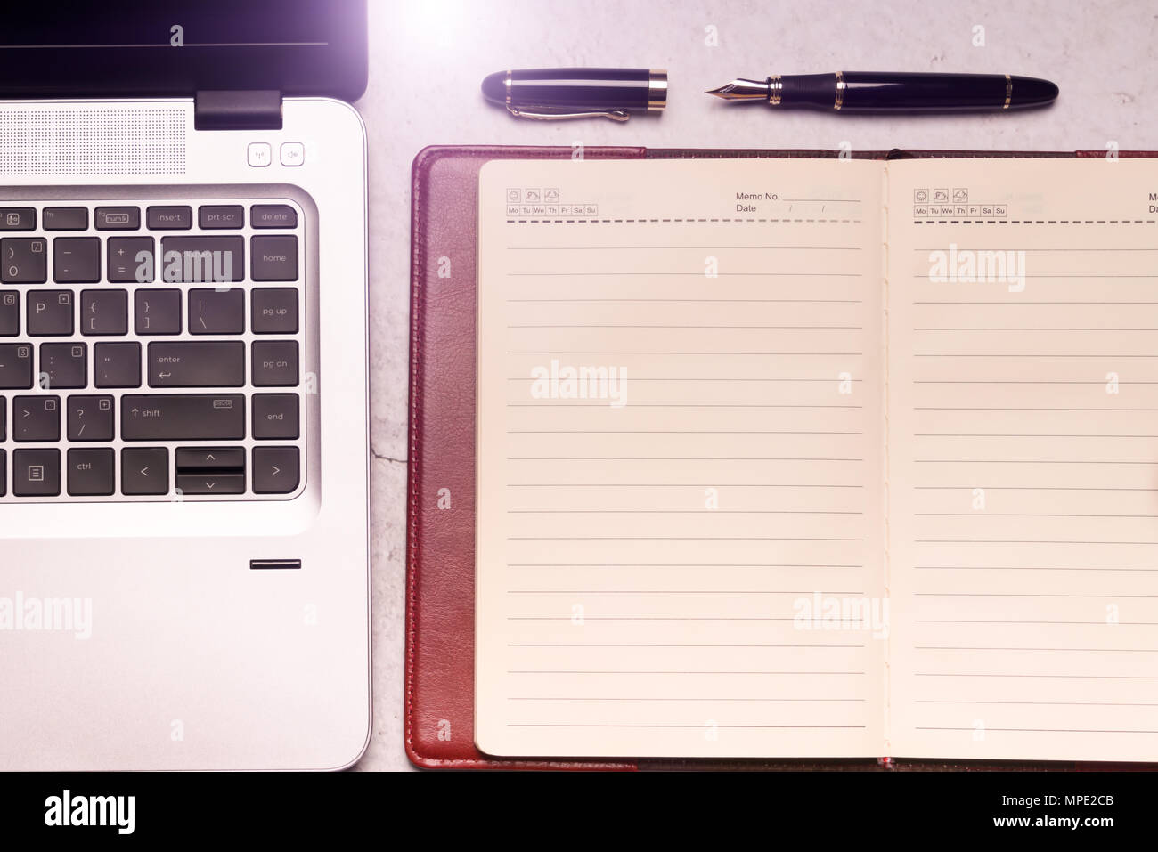 computer laptop and notebook on working table flat lay top view with ...