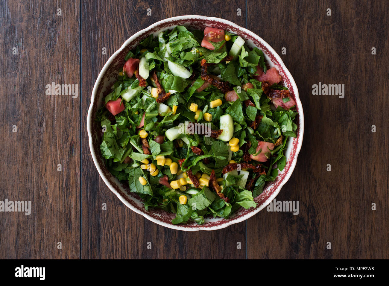 Rocket Salad with dried tomatoes, corn and cucumber. Organic food Stock ...