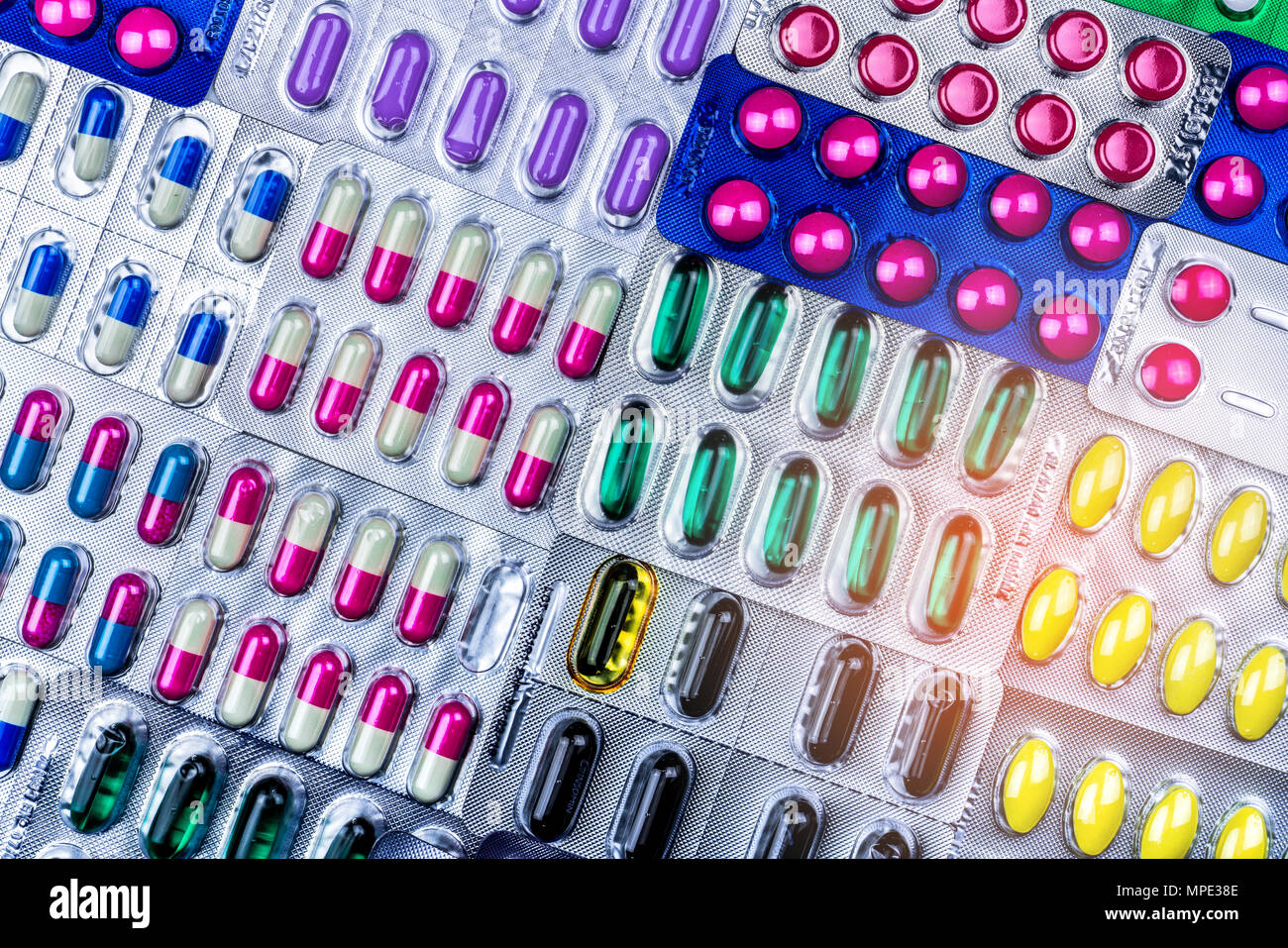 Colorful of tablets and capsules pill in blister packaging arranged ...