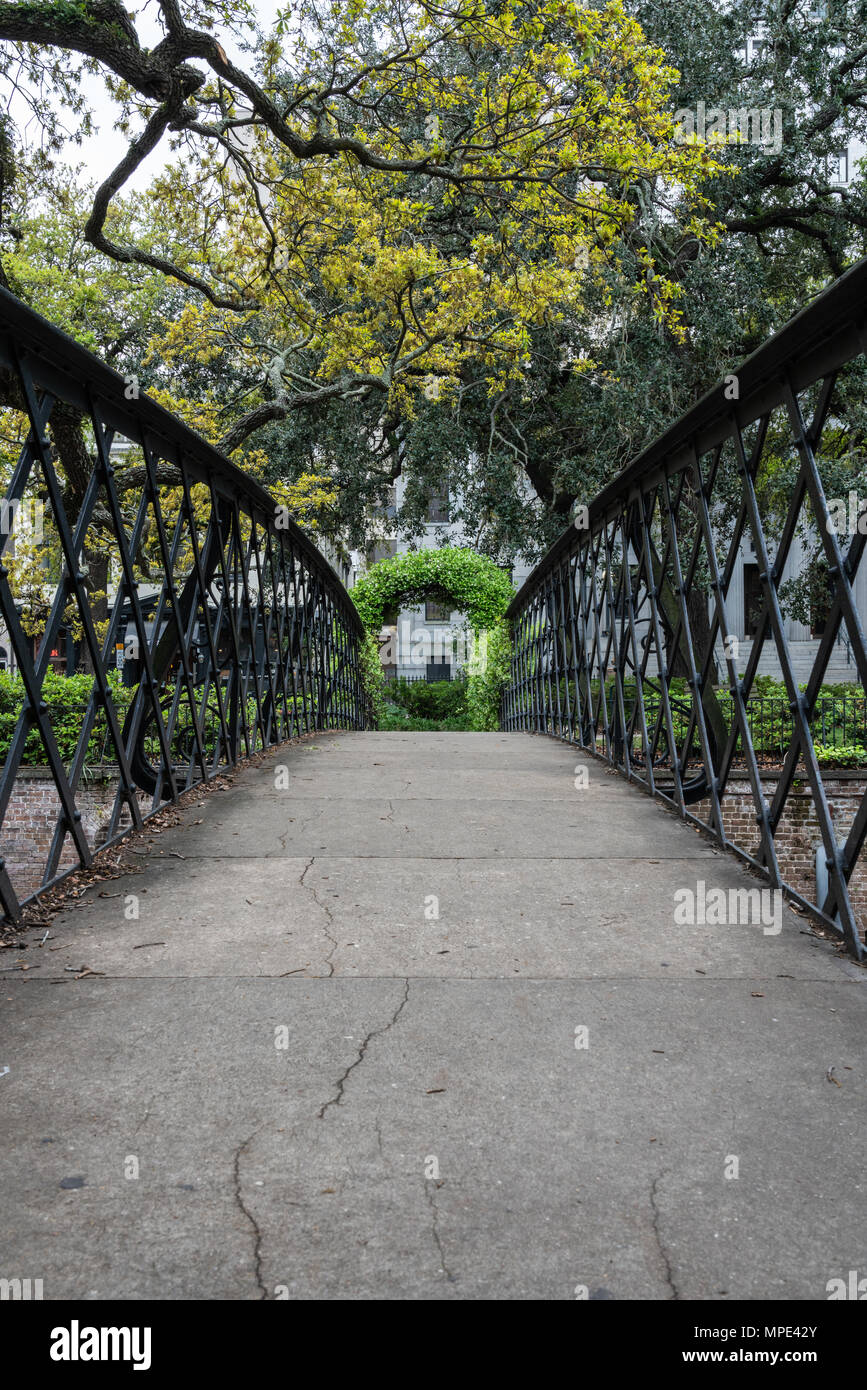 walkway with wrought iron railing Stock Photo - Alamy