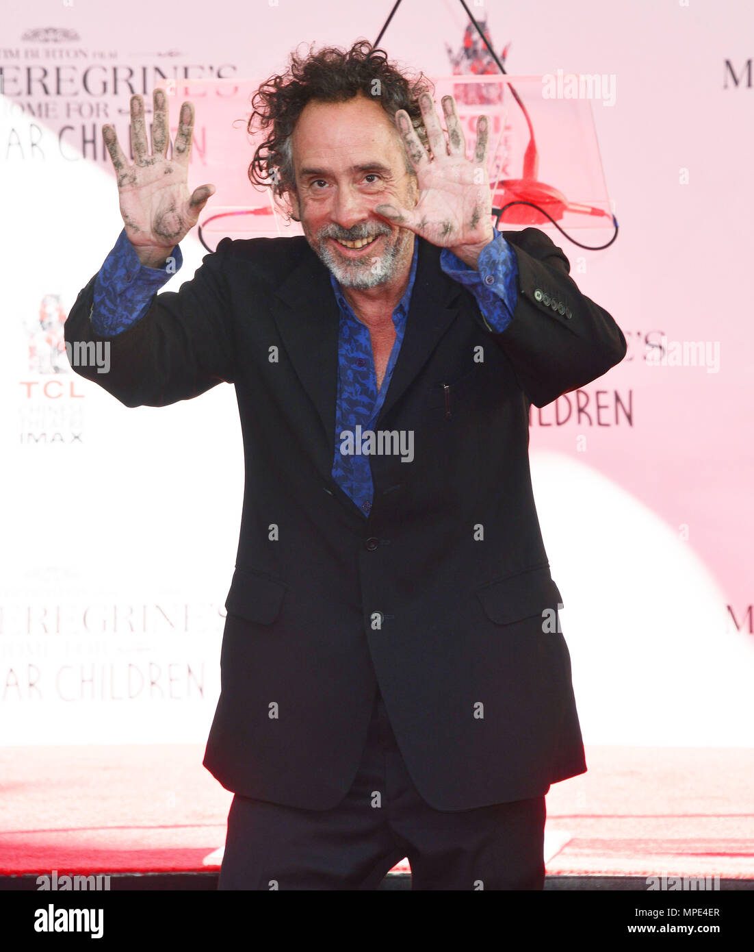 Tim Burton honored with hand and foot prints at the TCL Chinese Theatre ...