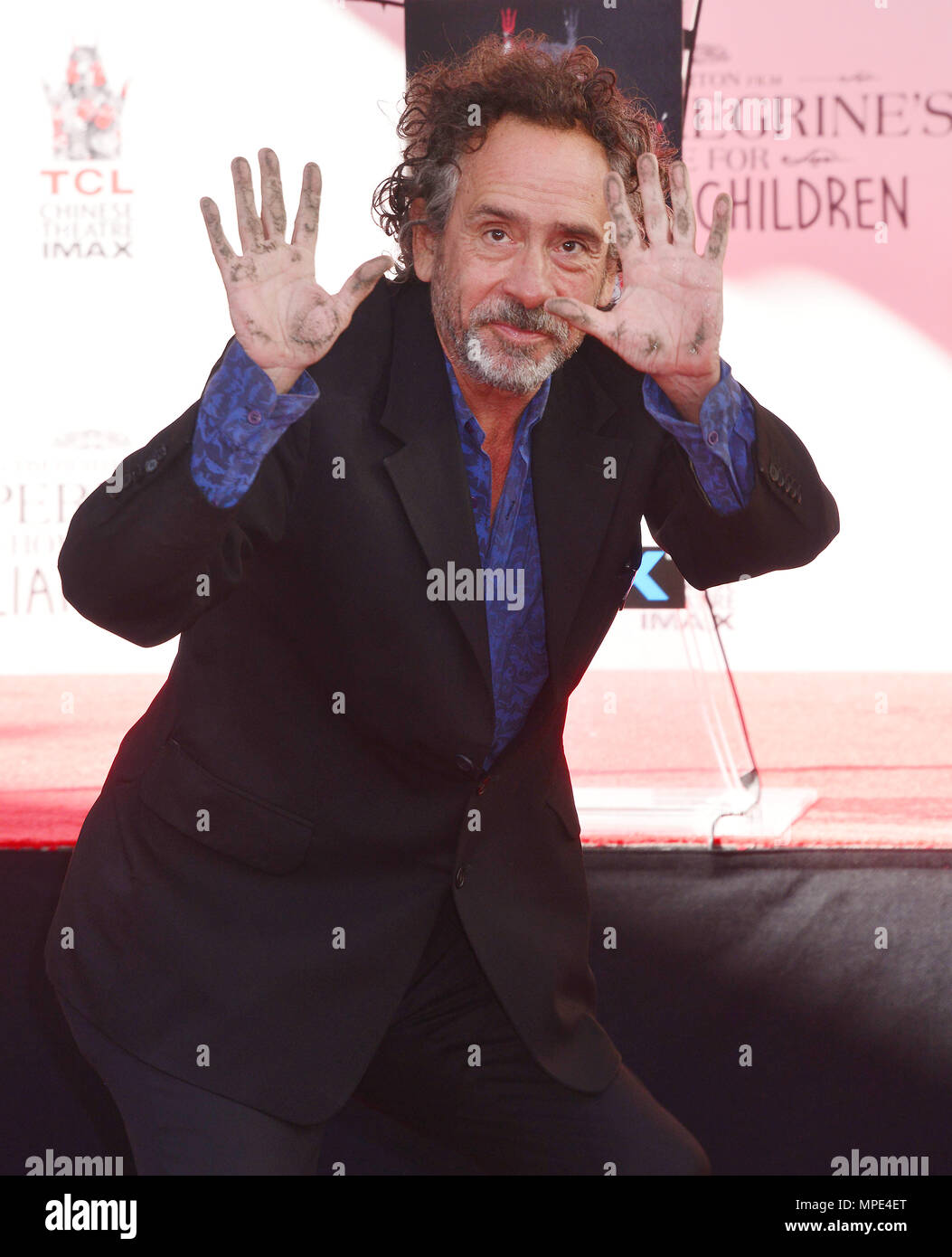 Tim Burton honored with hand and foot prints at the TCL Chinese Theatre ...
