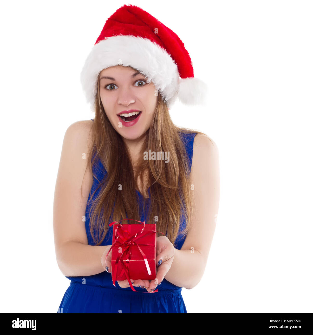 girl in a Christmas cap gift to rejoice on white background Stock Photo ...