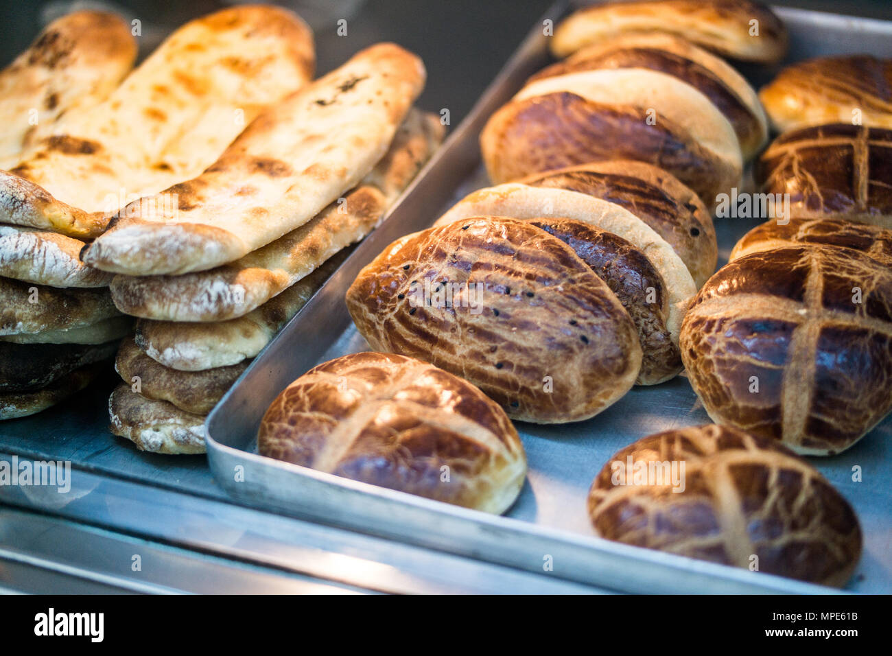 Turkish Pastries Pogaca and Pide at patisserie showcase. Turkish food ...
