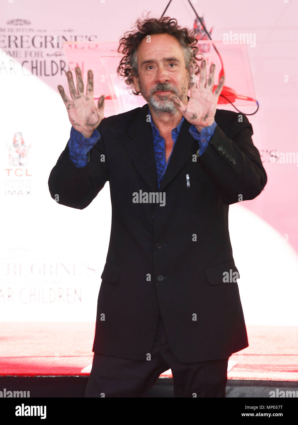 Tim Burton honored with hand and foot prints at the TCL Chinese Theatre ...