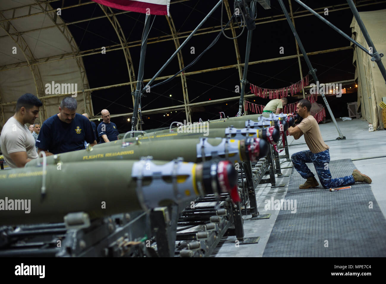 Members of the Royal Australian Air Force and U.S. Air Force construct ...