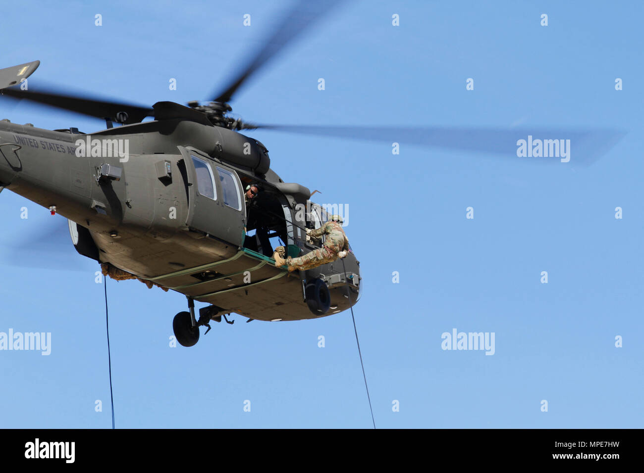 Soldiers rappel from a UH-60 Black Hawk helicopter at Fort Bliss, Texas ...