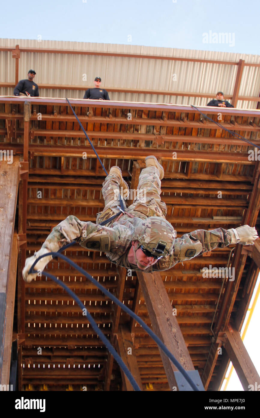 This photograph shows a U.S. Army National Guard soldier performing an ...