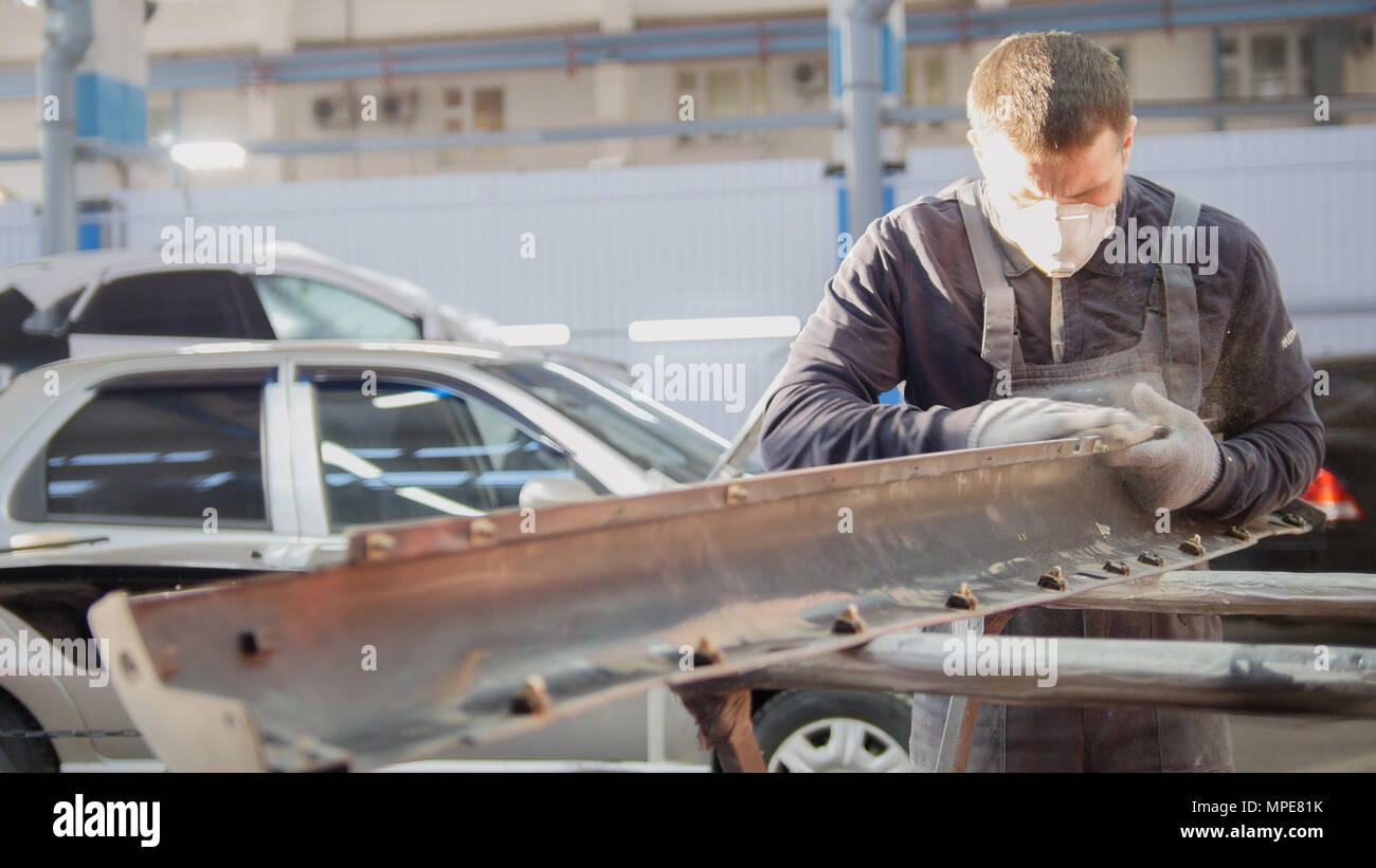 Mechanic repairing parts of the car Stock Photo - Alamy