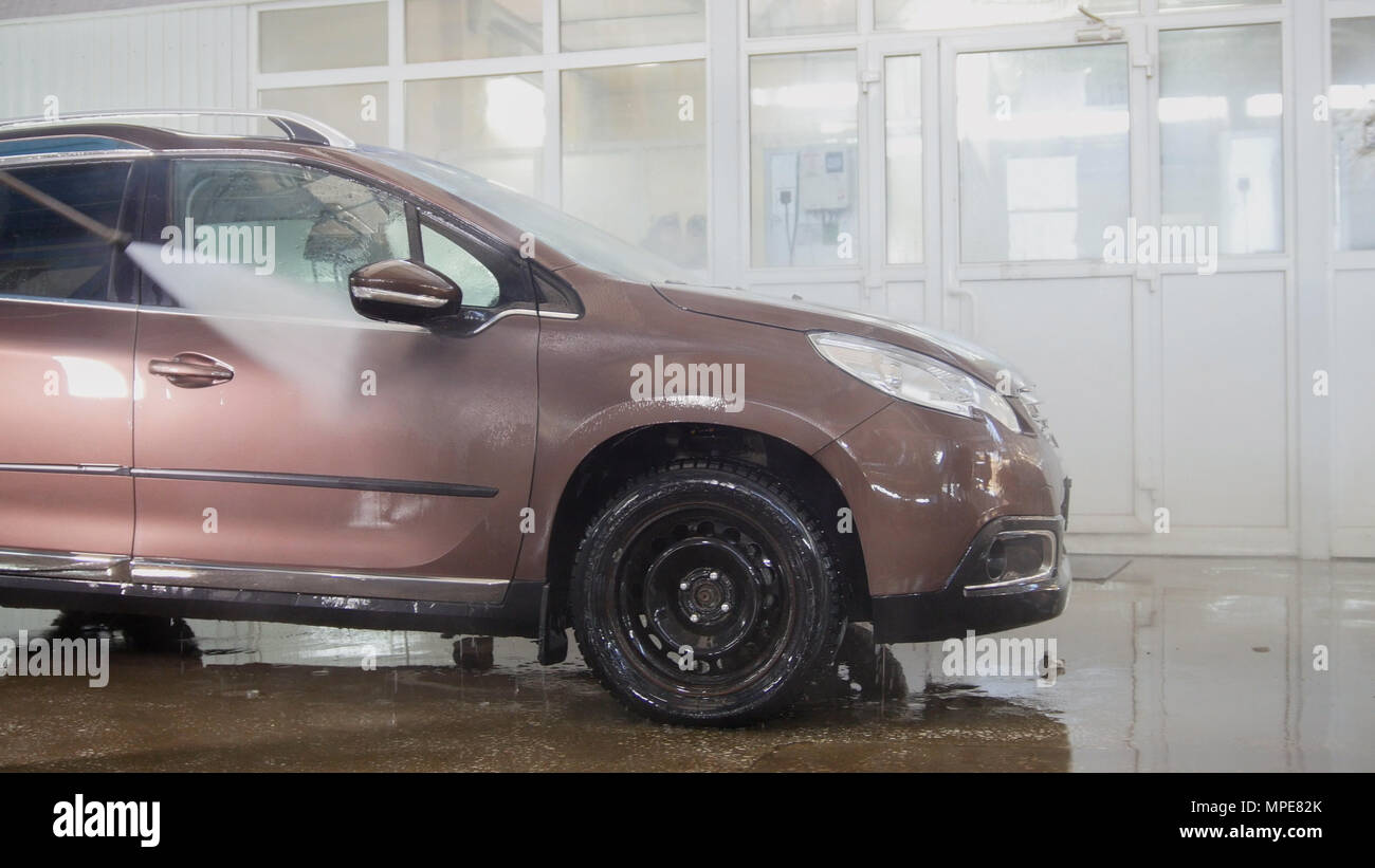 Washed car in car wash side view Stock Photo - Alamy