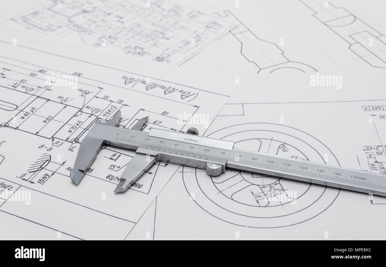 Vernier caliper lying on mechanical scheme Stock Photo - Alamy