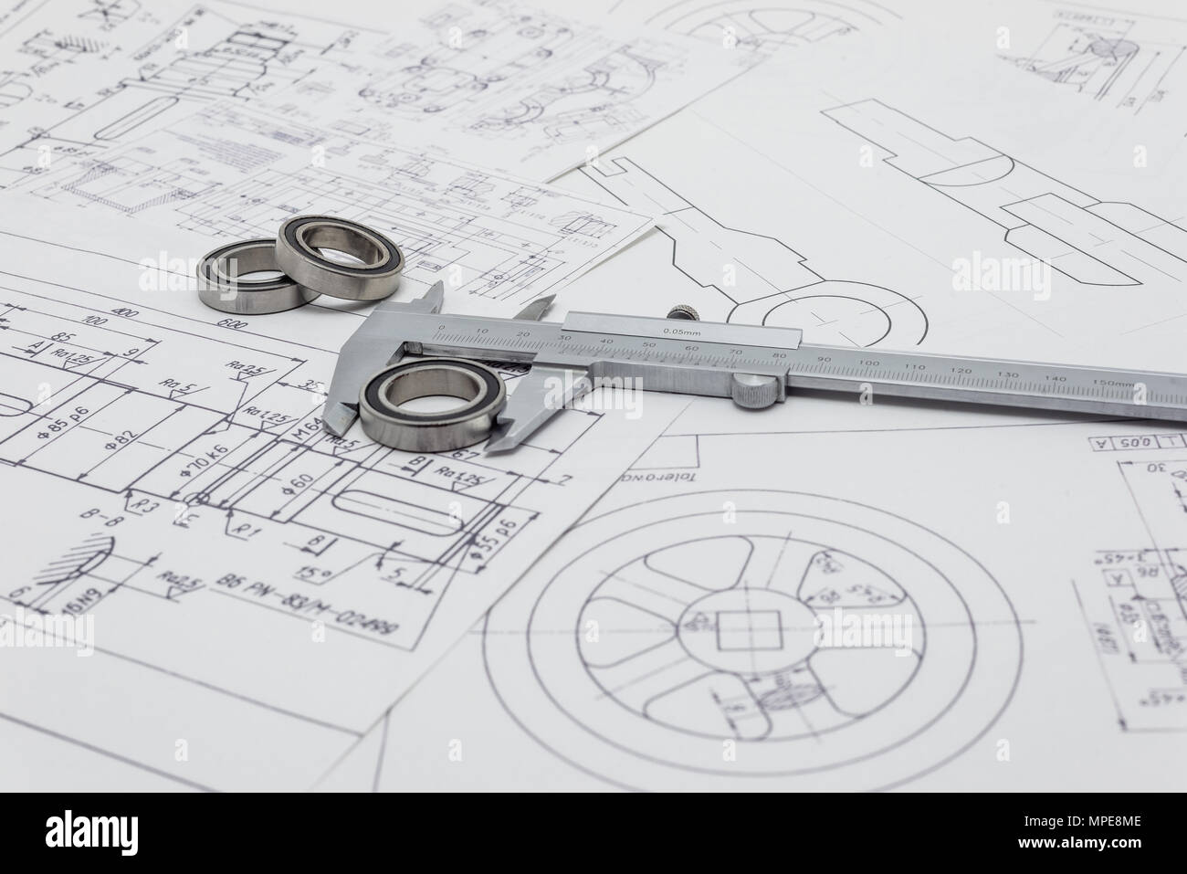 Vernier caliper lying on mechanical scheme with bearings Stock Photo ...