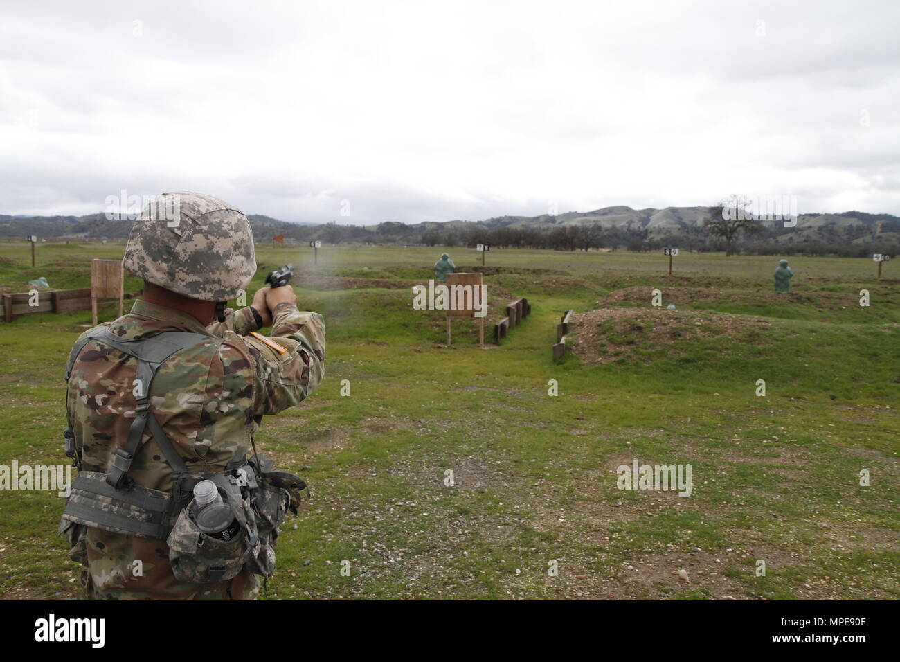 U.S. Army Reserve soldier Pfc. Juan Millan fires the M9 during the Best ...