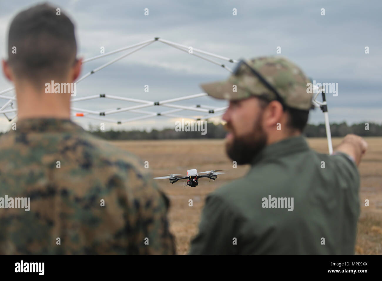 Shaun Sorensen, right, a small unmanned aerial systems instructor with ...