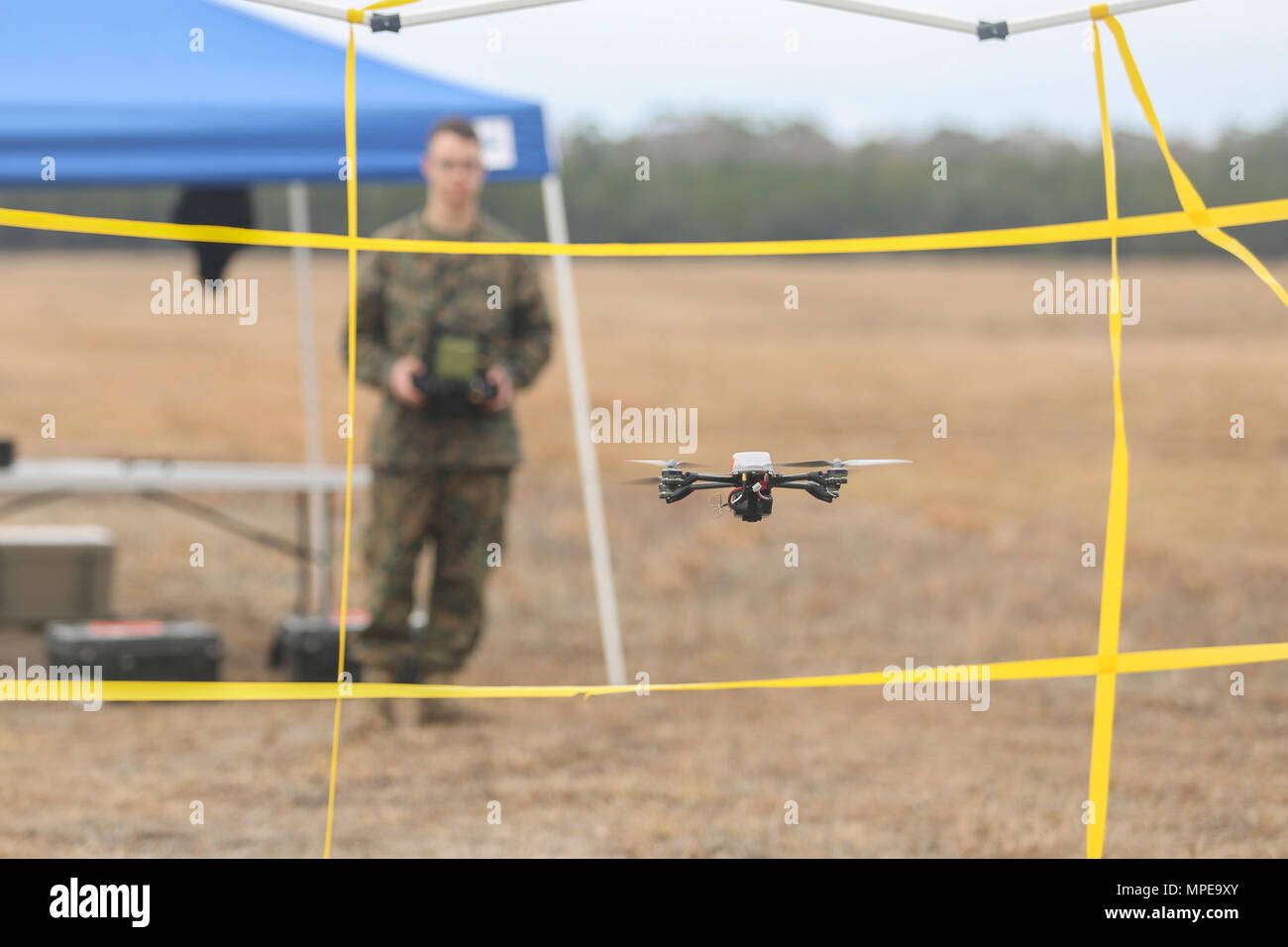 A Marine with Task Force Southwest flies the Instant Eye small unmanned ...