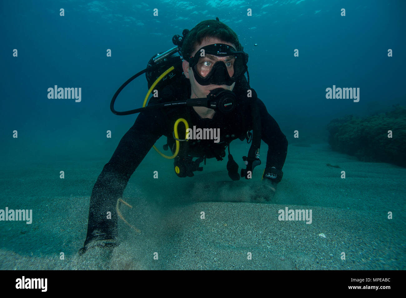 Construction Electrician 2nd Class Ben Coulson, assigned to Underwater ...