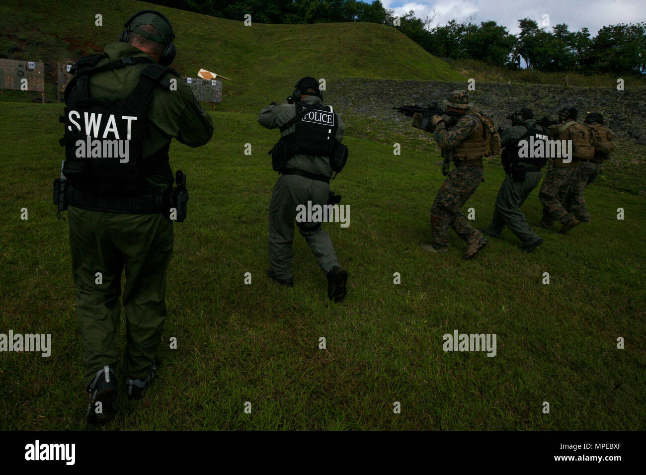 Police officers swat team members hi-res stock photography and images ...