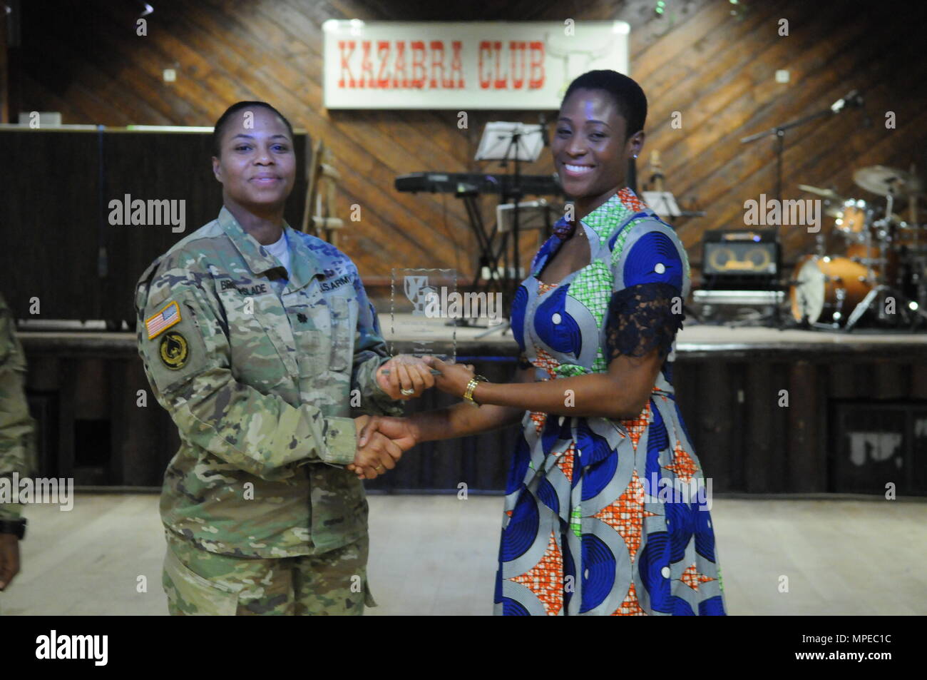 Lt. Col. Caprissa Brown-Slade (left) presents guest speaker Sgt. Asi ...