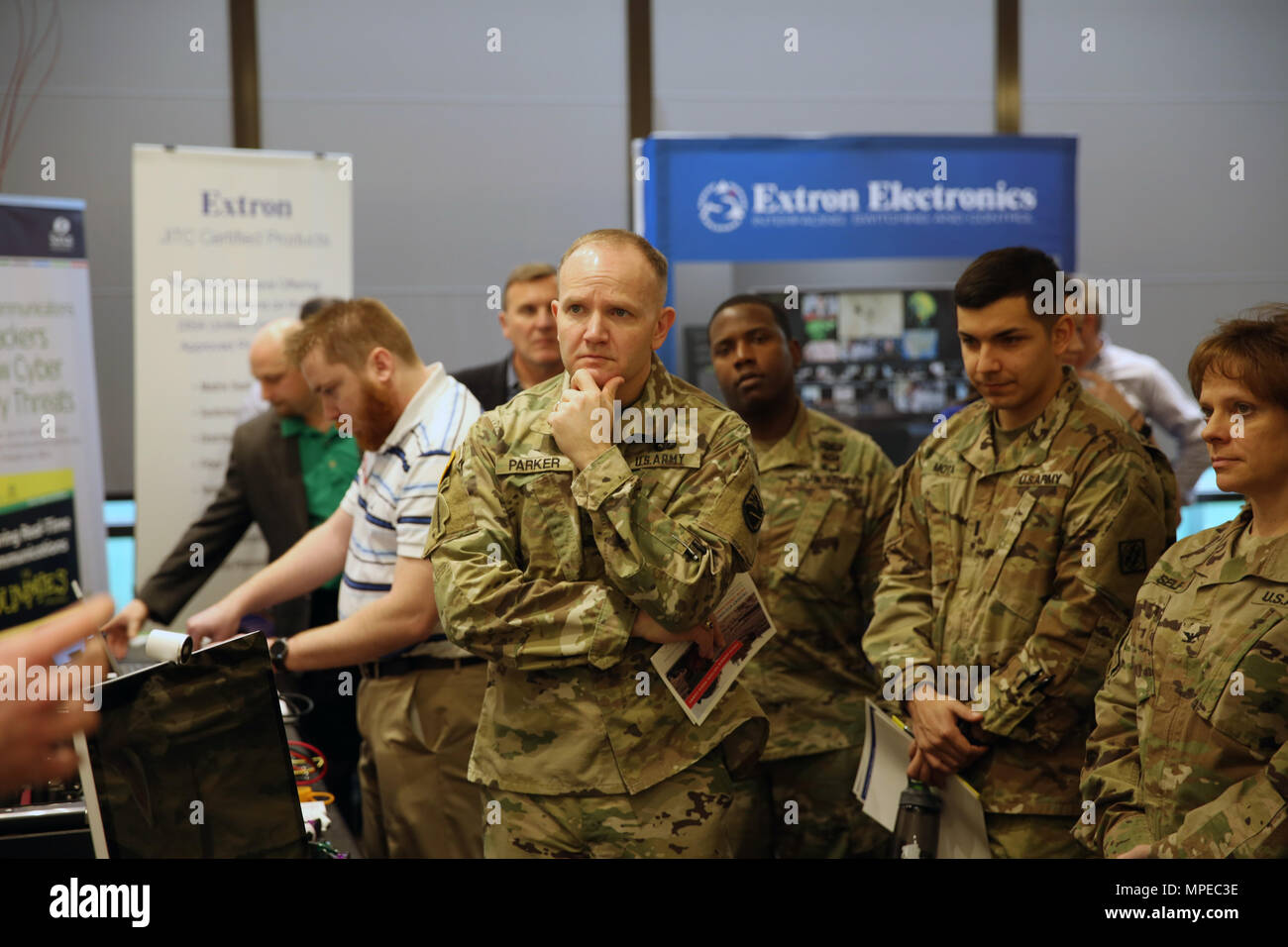 Col. Rob Parker, commander of 5th Signal Command (Theater), listens to ...