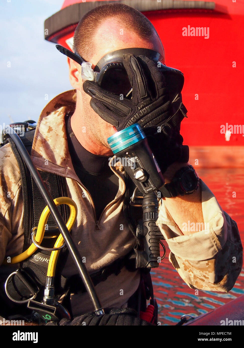 U.S. Navy Explosive Ordinance Disposal Mobility Unit (EODMU) personnel ...