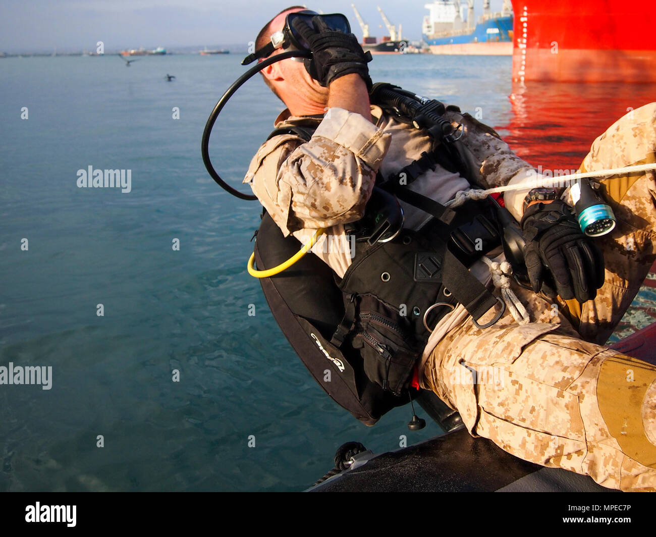 U.S. Navy Explosive Ordinance Disposal Mobility Unit (EODMU) personnel ...
