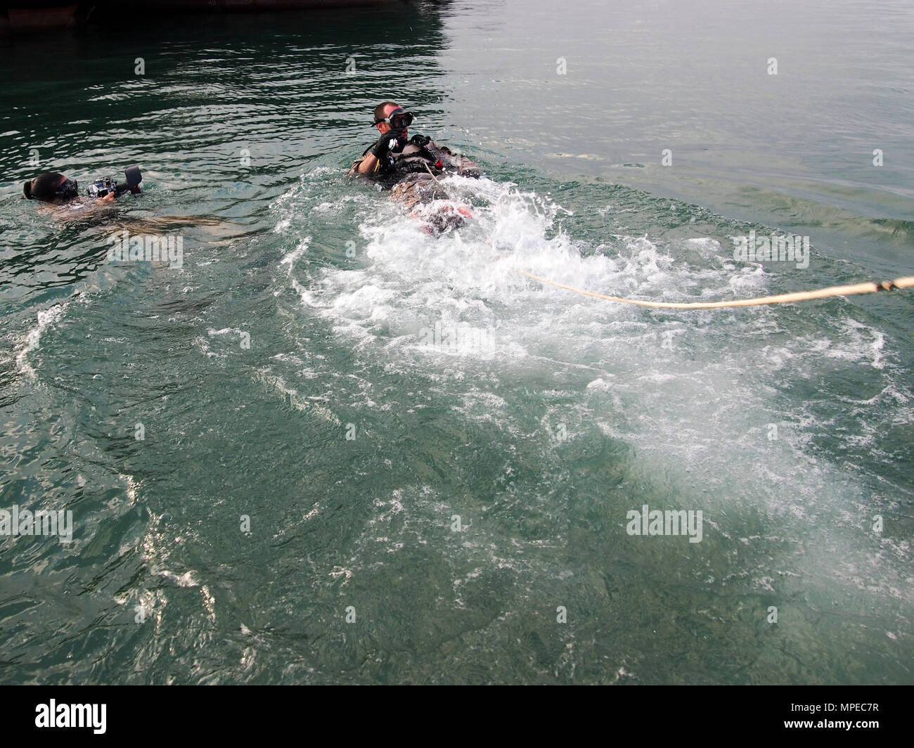 U.S. Navy Explosive Ordinance Disposal Mobility Unit (EODMU) personnel ...