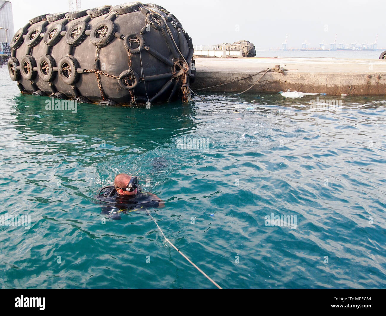 U.S. Navy Explosive Ordinance Disposal Mobility Unit (EODMU) personnel ...