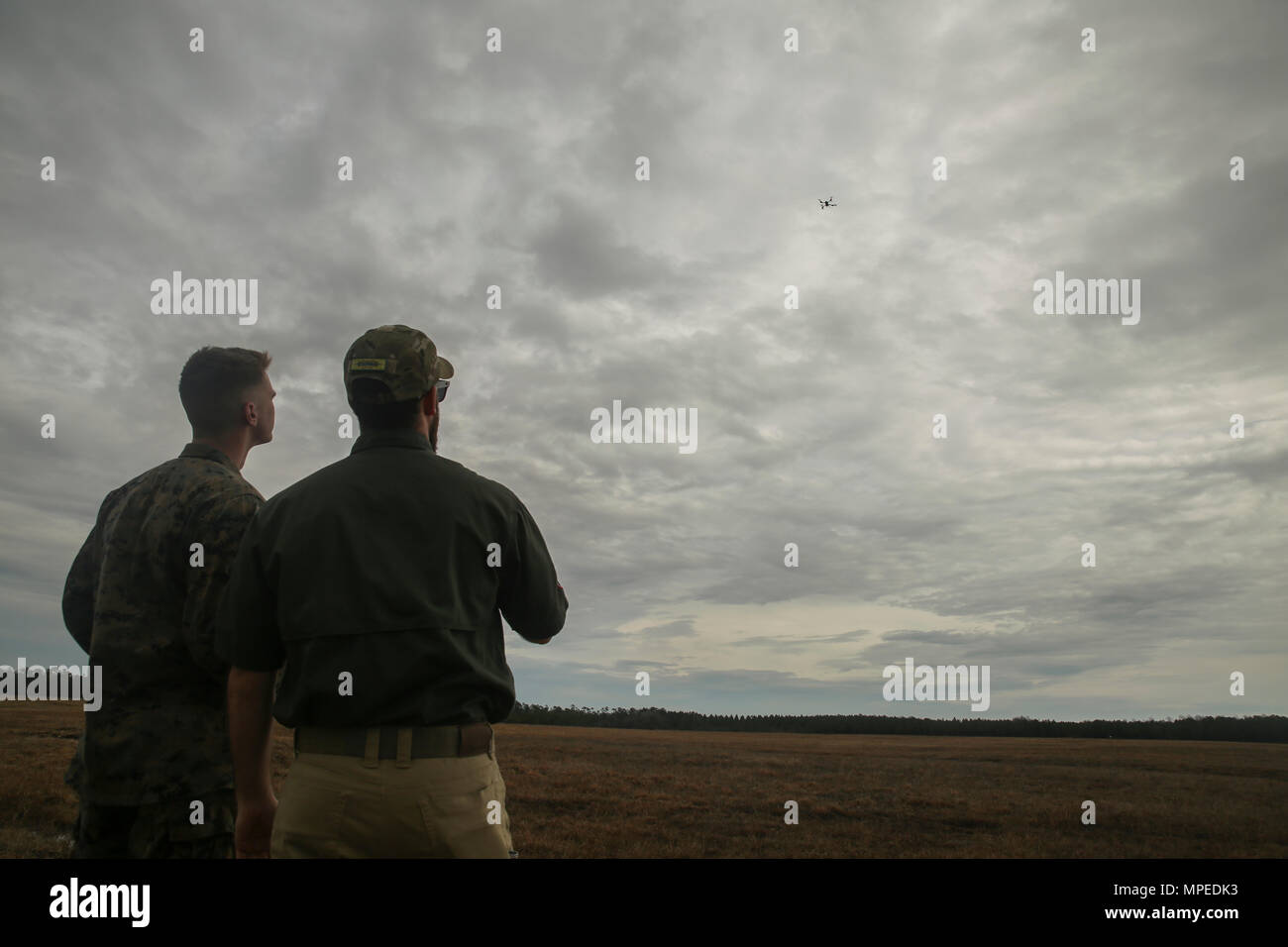 Shaun Sorensen, right, a small unmanned aerial systems instructor with ...