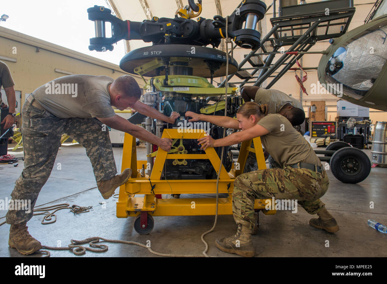 Members of the 82nd Combat Aviation Brigade tear down a CH-47 Chinook ...