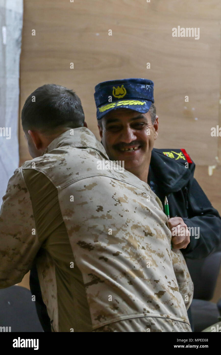 An Iraqi federal police staff general officer greets a U.S. Marine ...