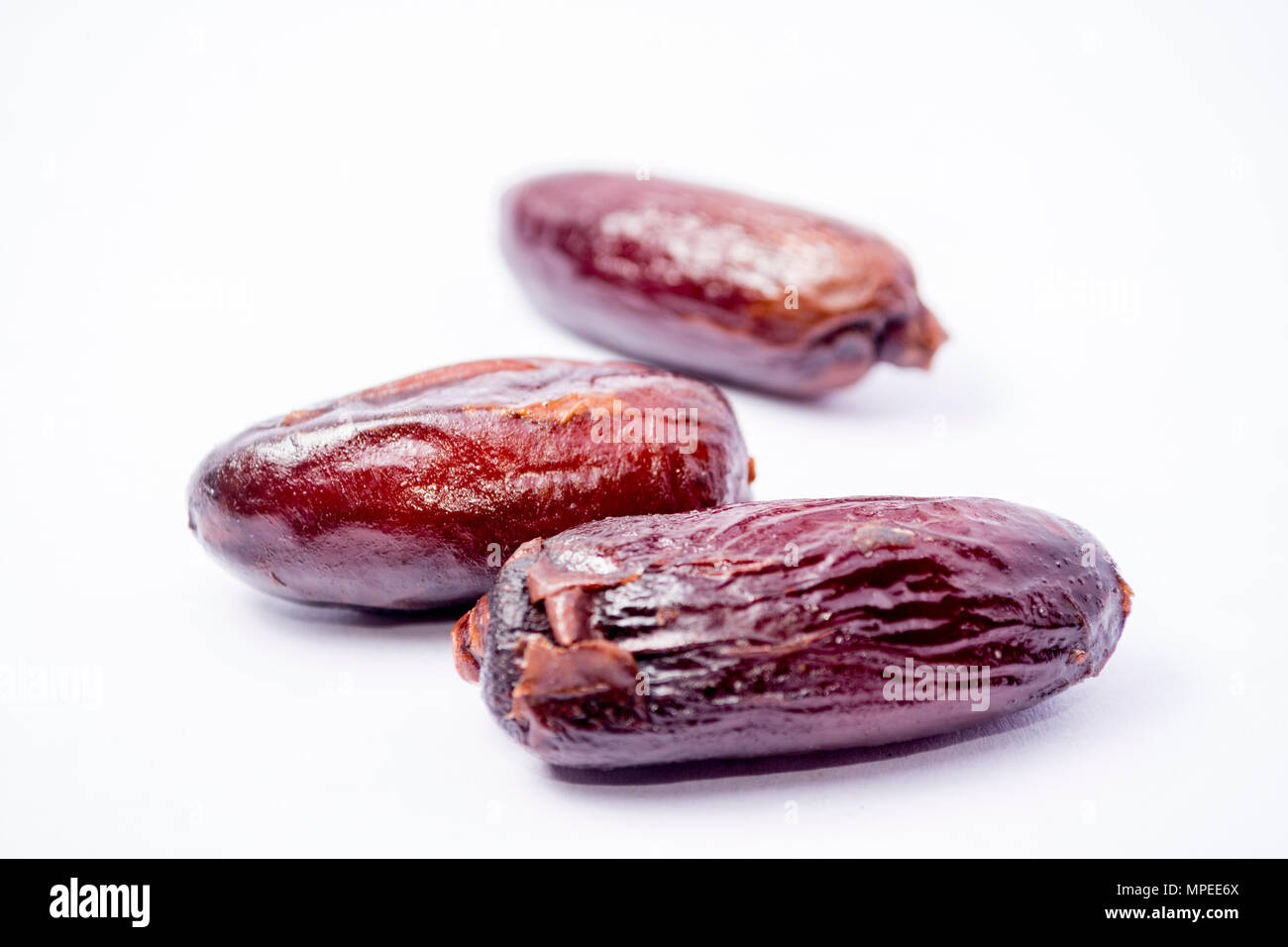 Dates in white background Stock Photo - Alamy