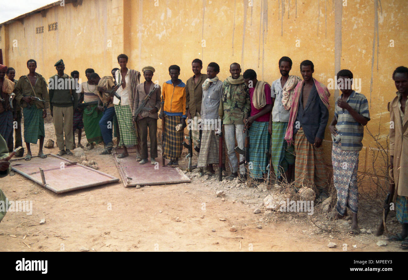 MEN STANDING IN LINE WITH GUNS Stock Photo - Alamy