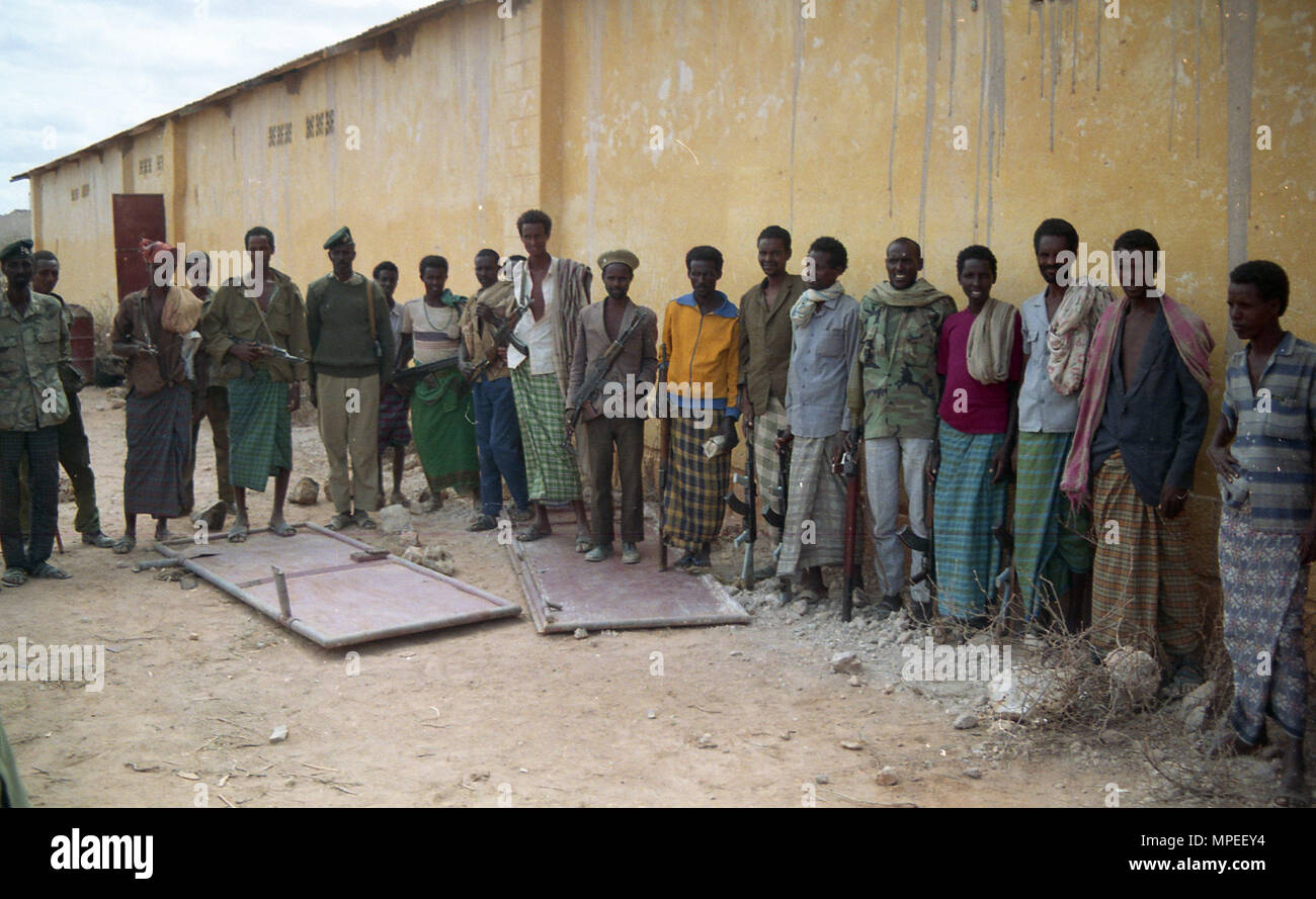 MEN STANDING IN LINE WITH GUNS Stock Photo - Alamy