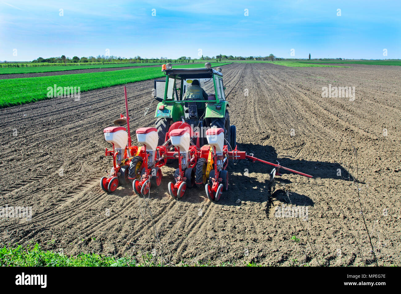 Tractor sows hi-res stock photography and images - Alamy