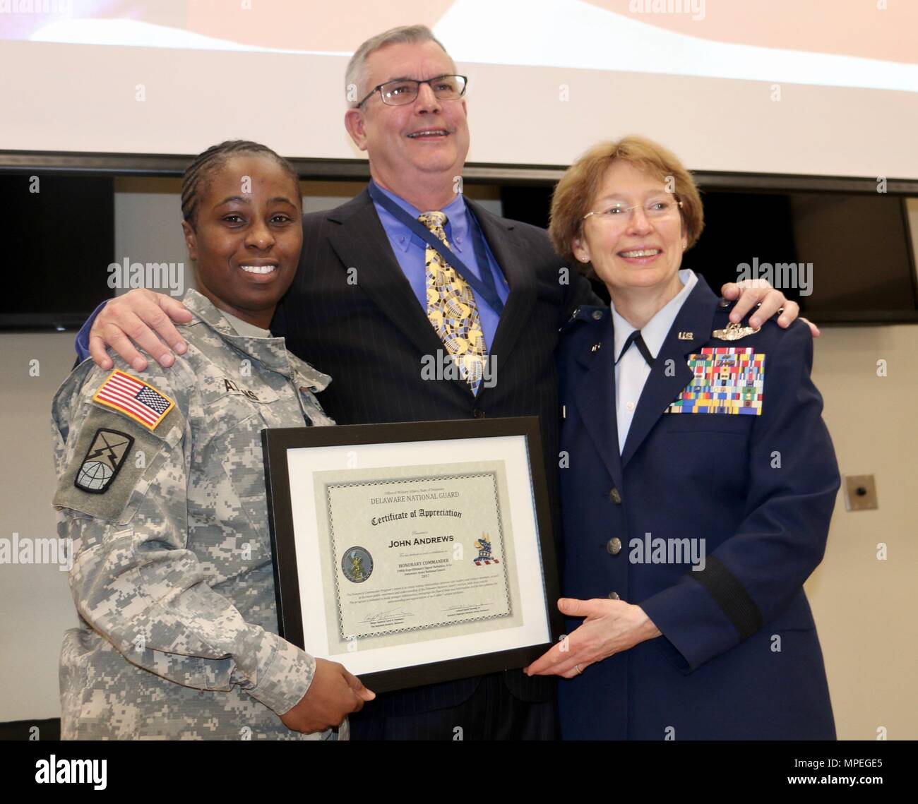 Maj. Gen. Carol Timmons and Cpt. Edlynn Atkins present Mr. John Andrews ...