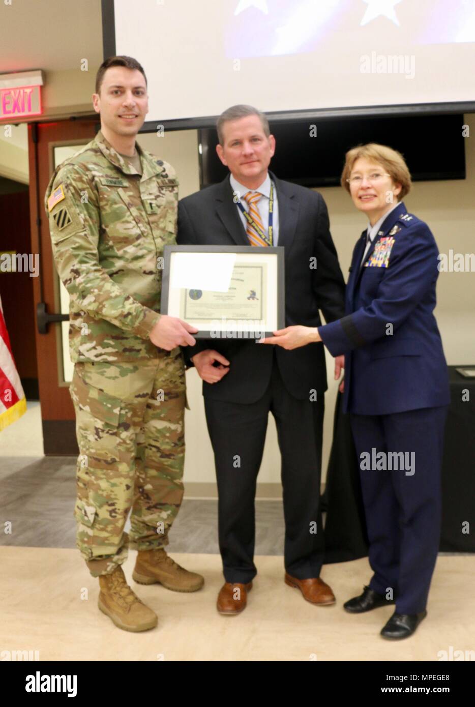 Maj. Gen. Carol Timmons and 1st Lt. Adam Fenimore present Mr. John ...