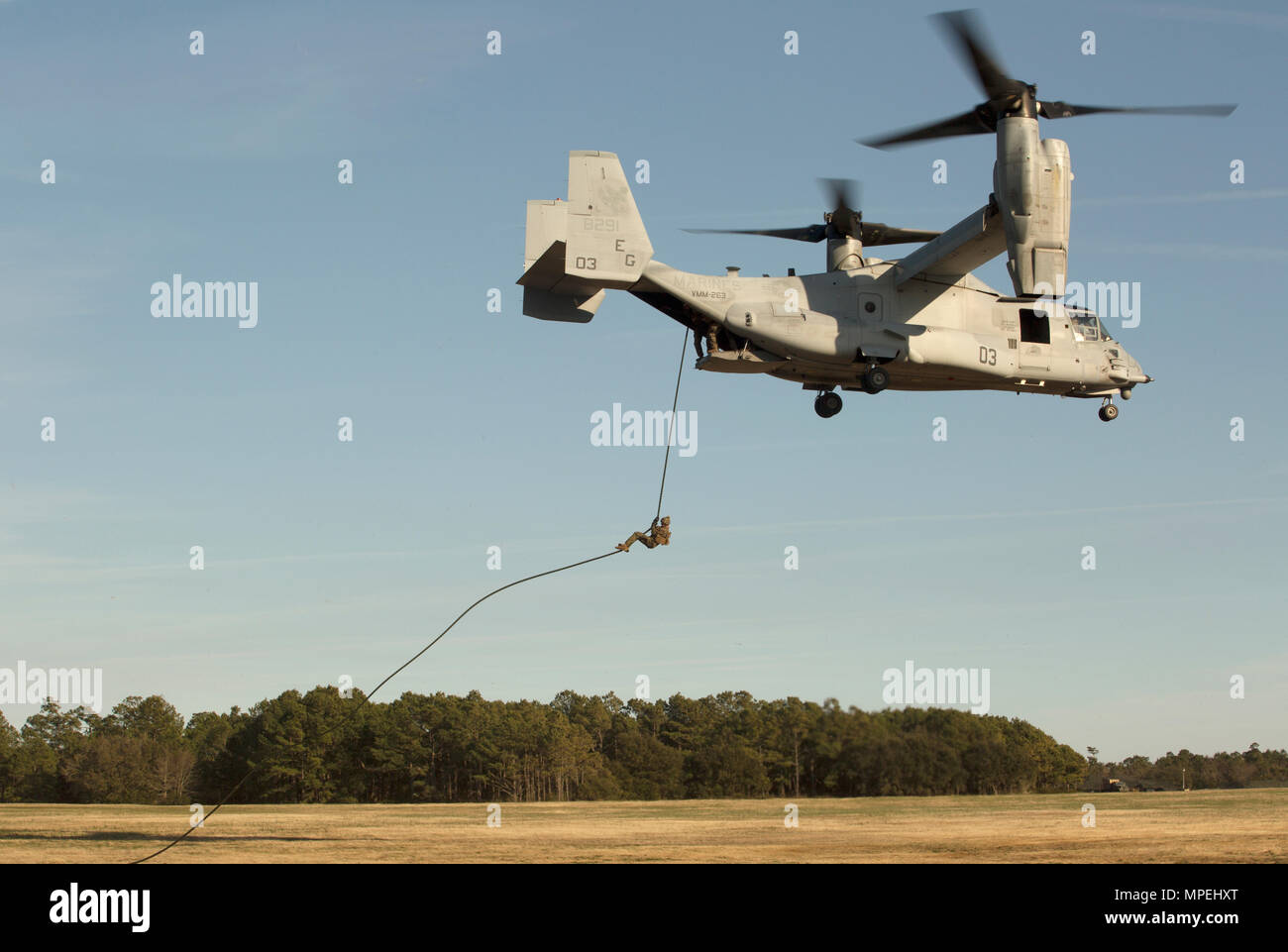 A Marine rappels out of an MV-22B Osprey at Camp Lejeune, N.C., Feb. 14 ...