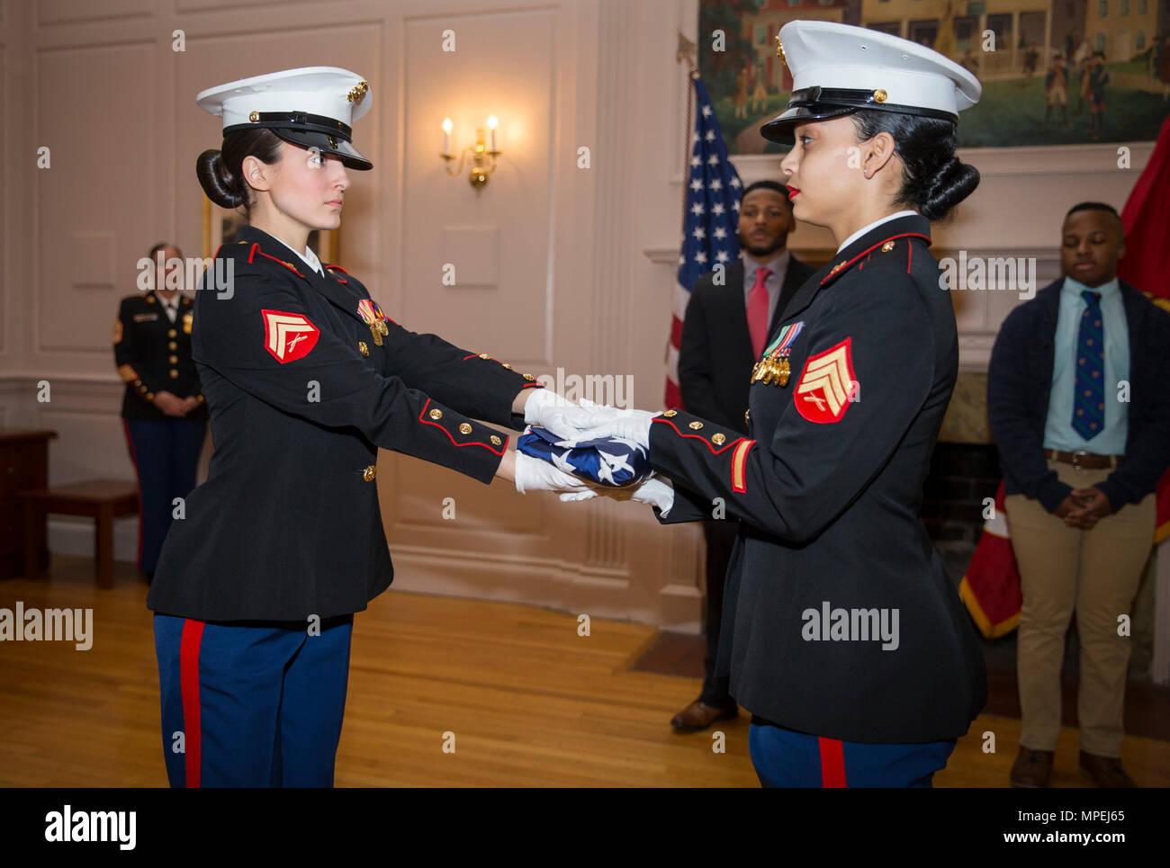 U.S. Marines pass the American flag during the Old Glory tribute at the ...