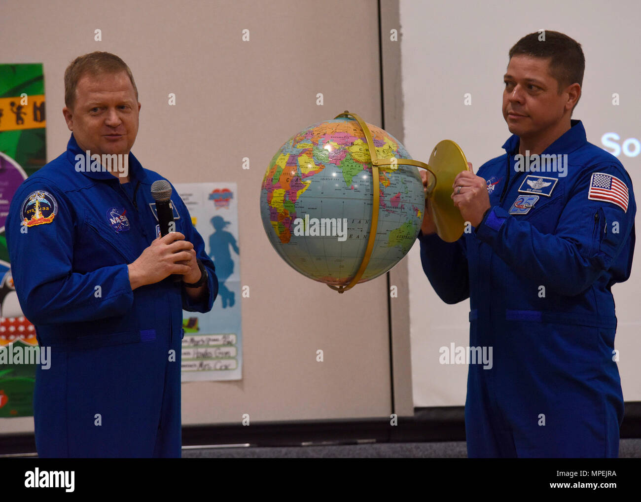 NASA astronauts Eric Boe (left) and Bob Behnken (right) Illustrate ...