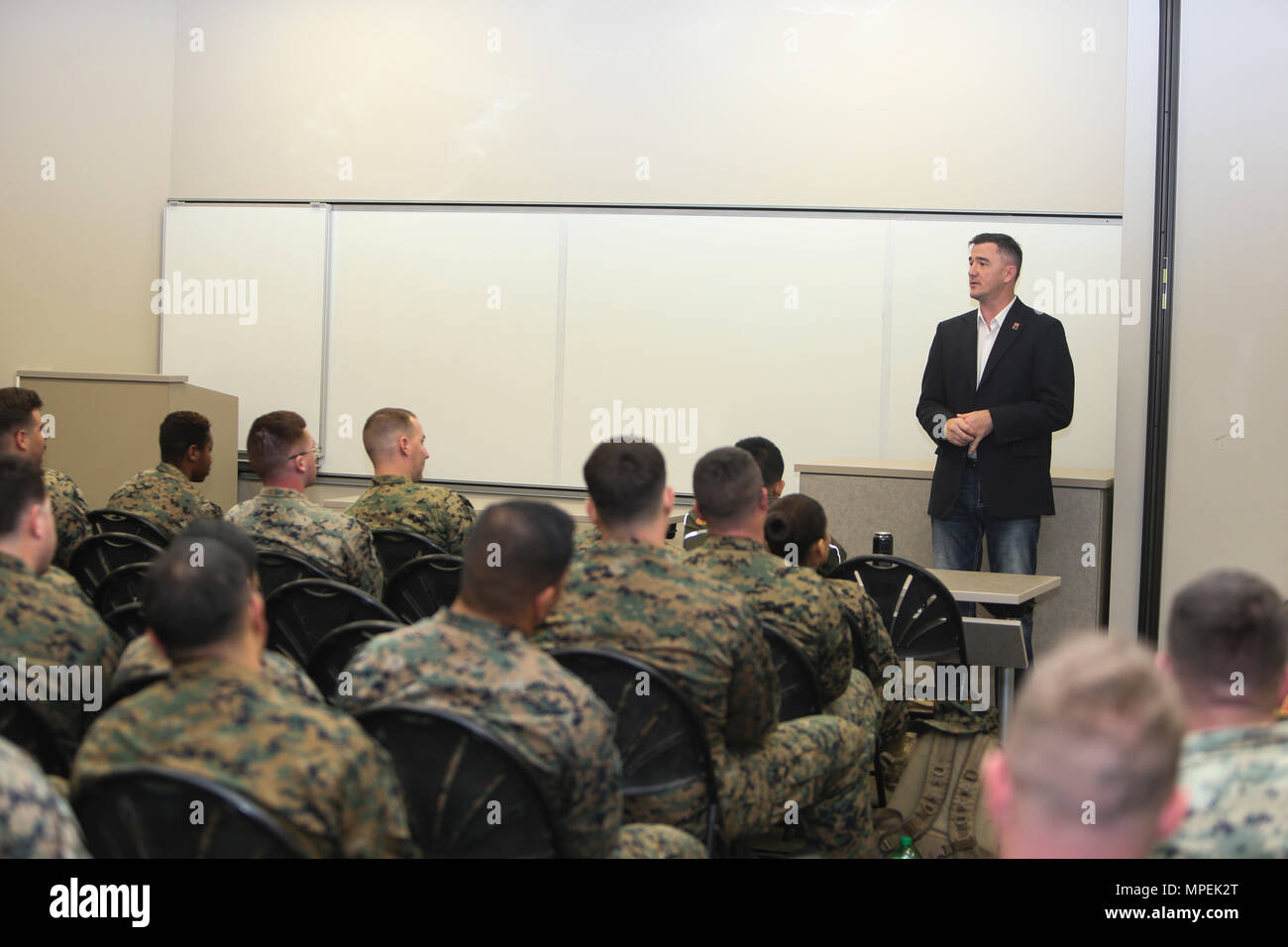 U.S. Marine Corps Staff Sgt. John Jones (retired), speaks to Marines of ...