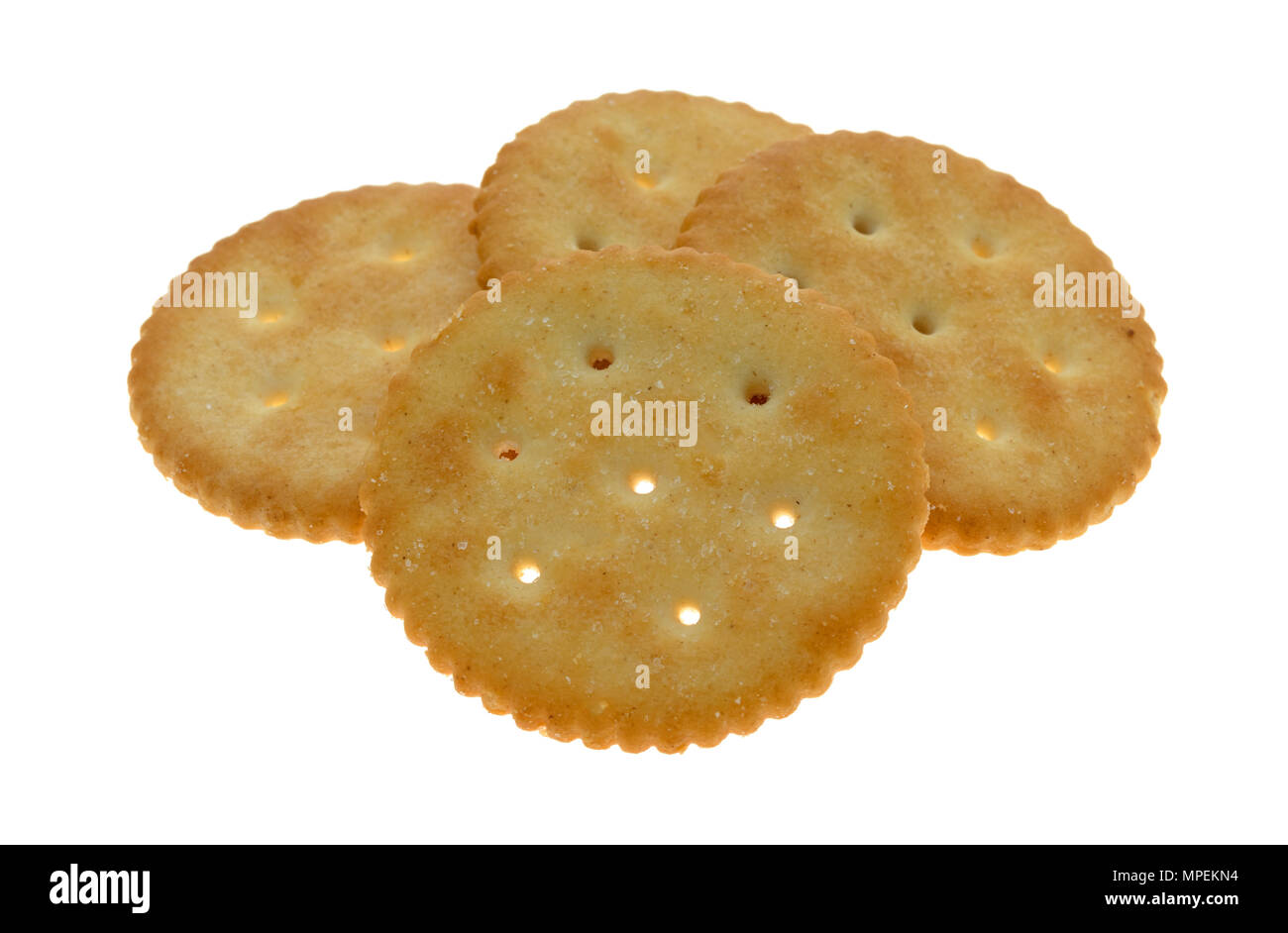 A small group of yellow snack crackers with holes isolated on a white ...