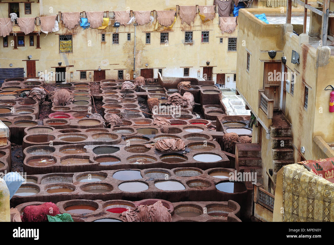 view over ancient tannery with dye vats and hides drying at facades ...