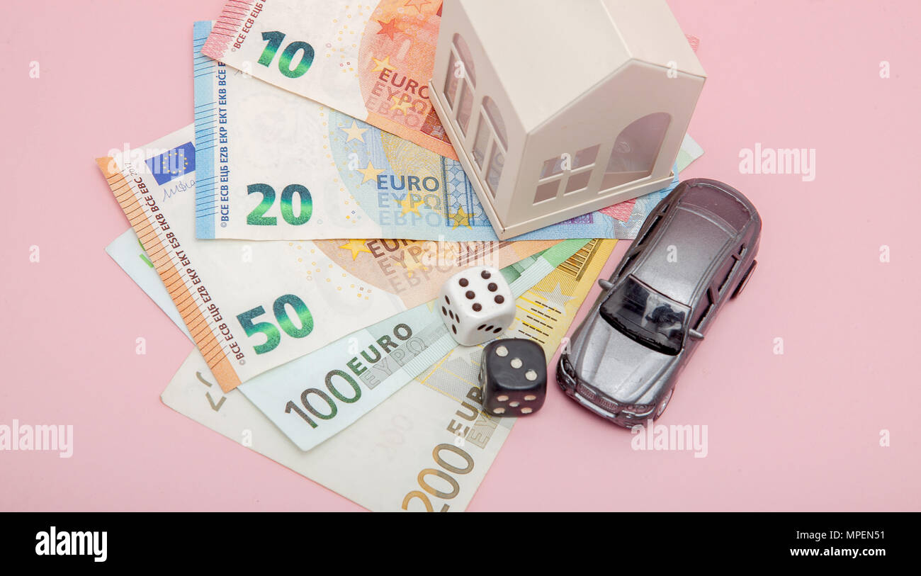 Casino, gambling and fortune concept. Model house and car, games dice ...