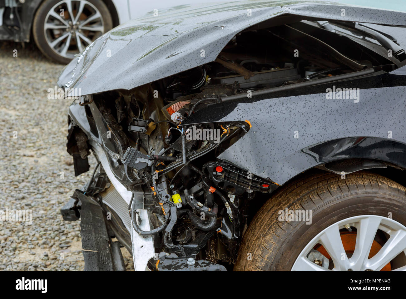 Broken car after accident, view of car front down after an explosion ...