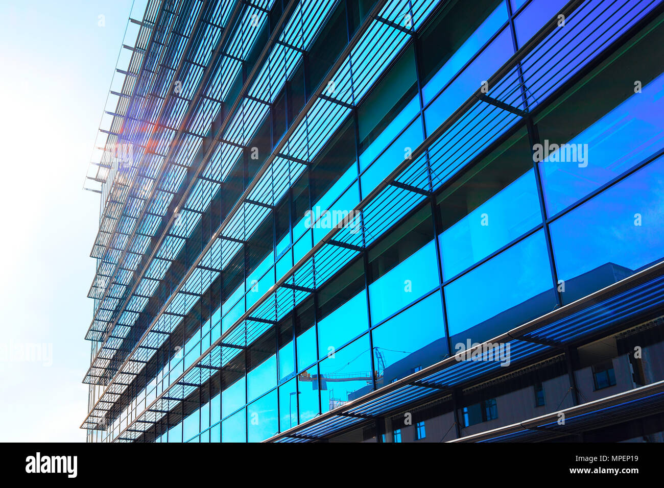 Windows of futuristic metal and glass skyscraper building reflecting ...