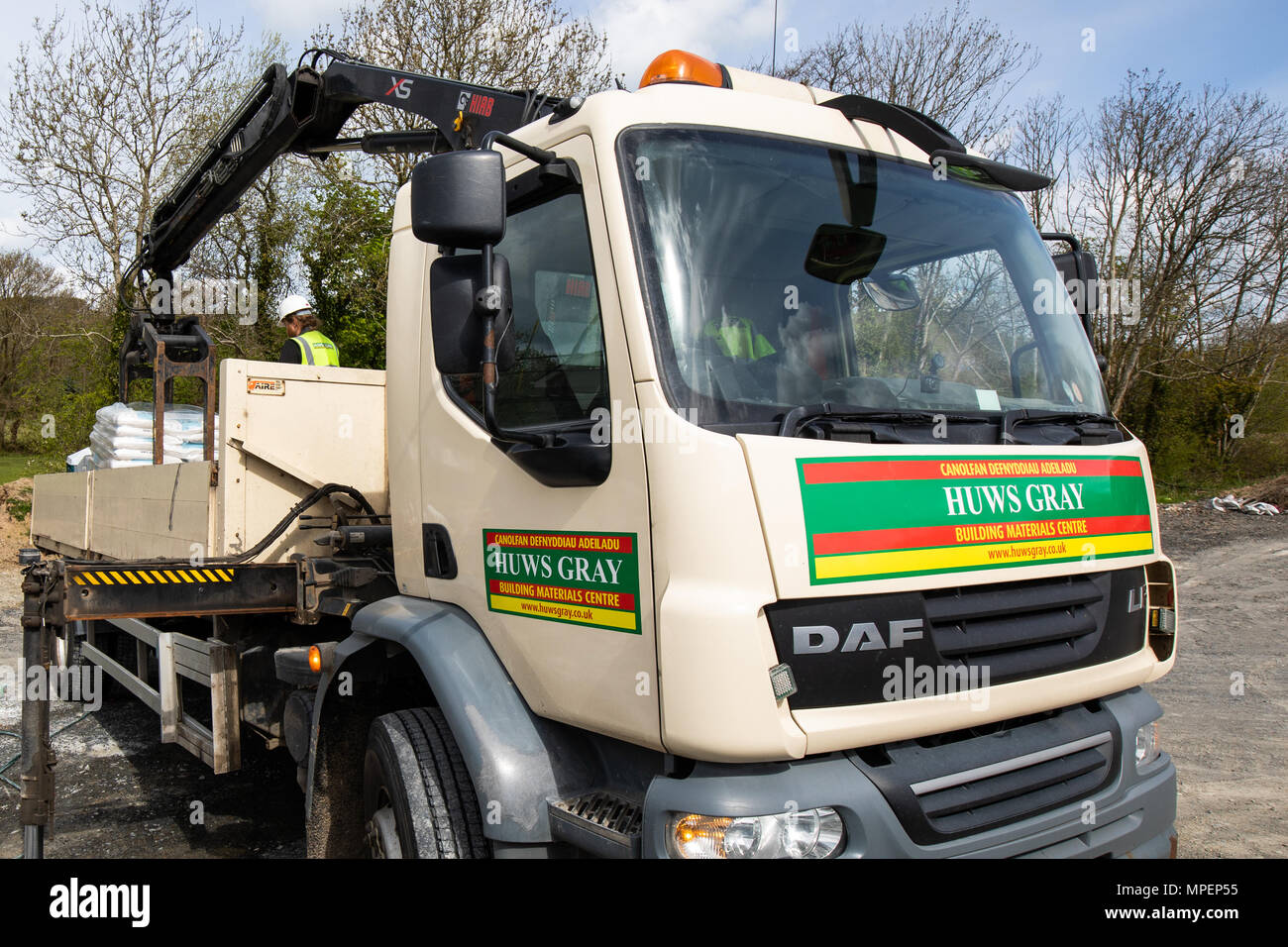 A Huws Gray builders merchant lorry delivering building products Stock ...