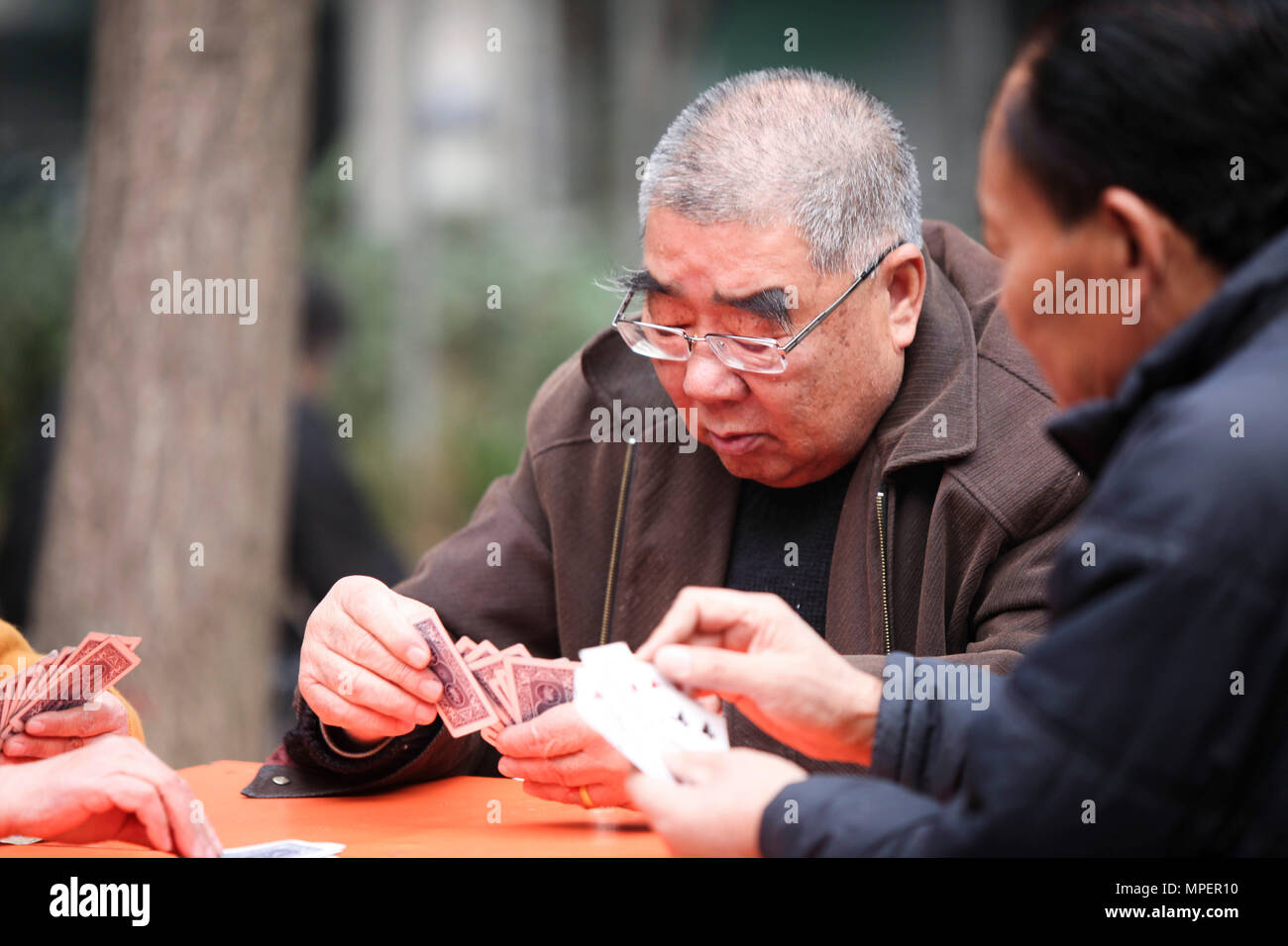 Chinese old man gambling with a cards game in Hangzhou, China Stock ...